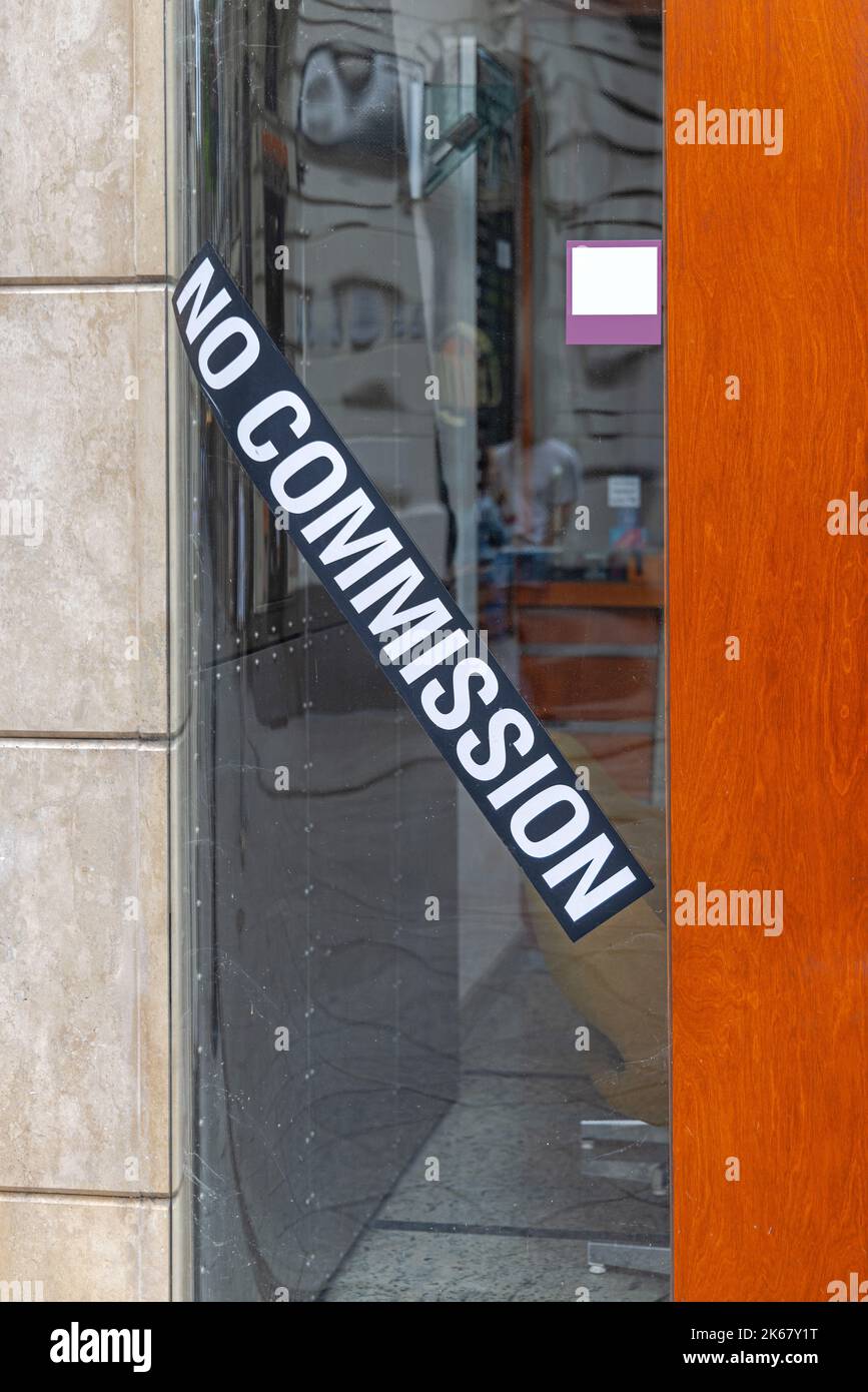 No Commission Sign at Money Exchange Office Glass Door Stock Photo - Alamy