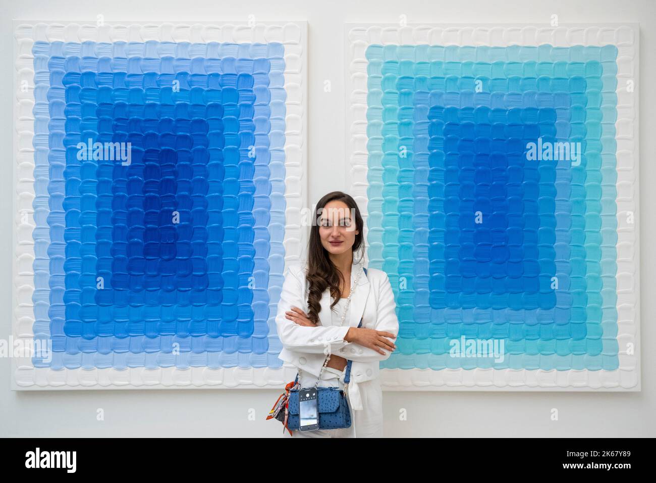 London, UK. 12 October 2022. Artist Hannah Nijsten with her works (L ...