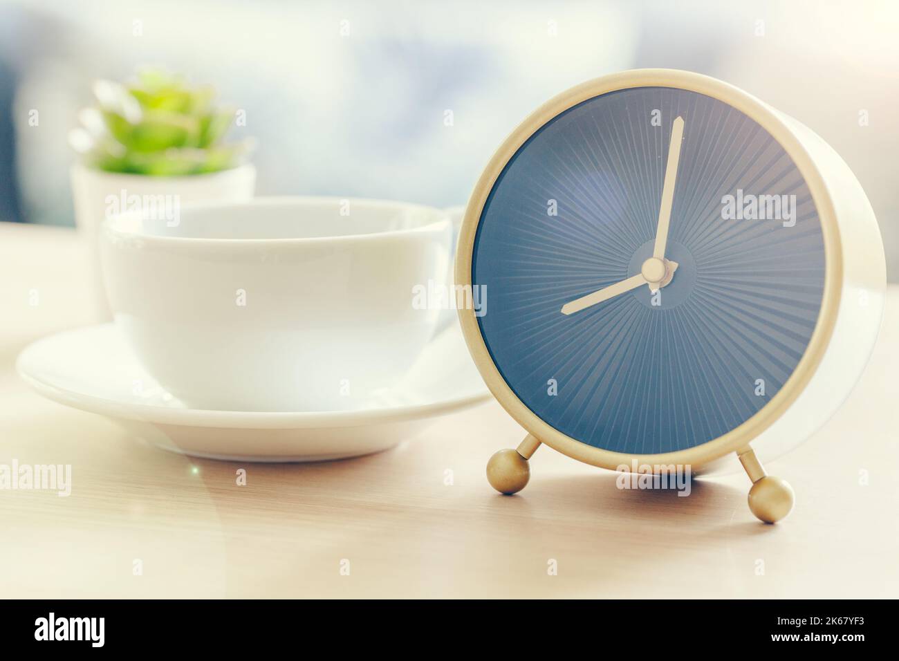 Morning sun. Alarm clock on a beautiful background Stock Photo - Alamy