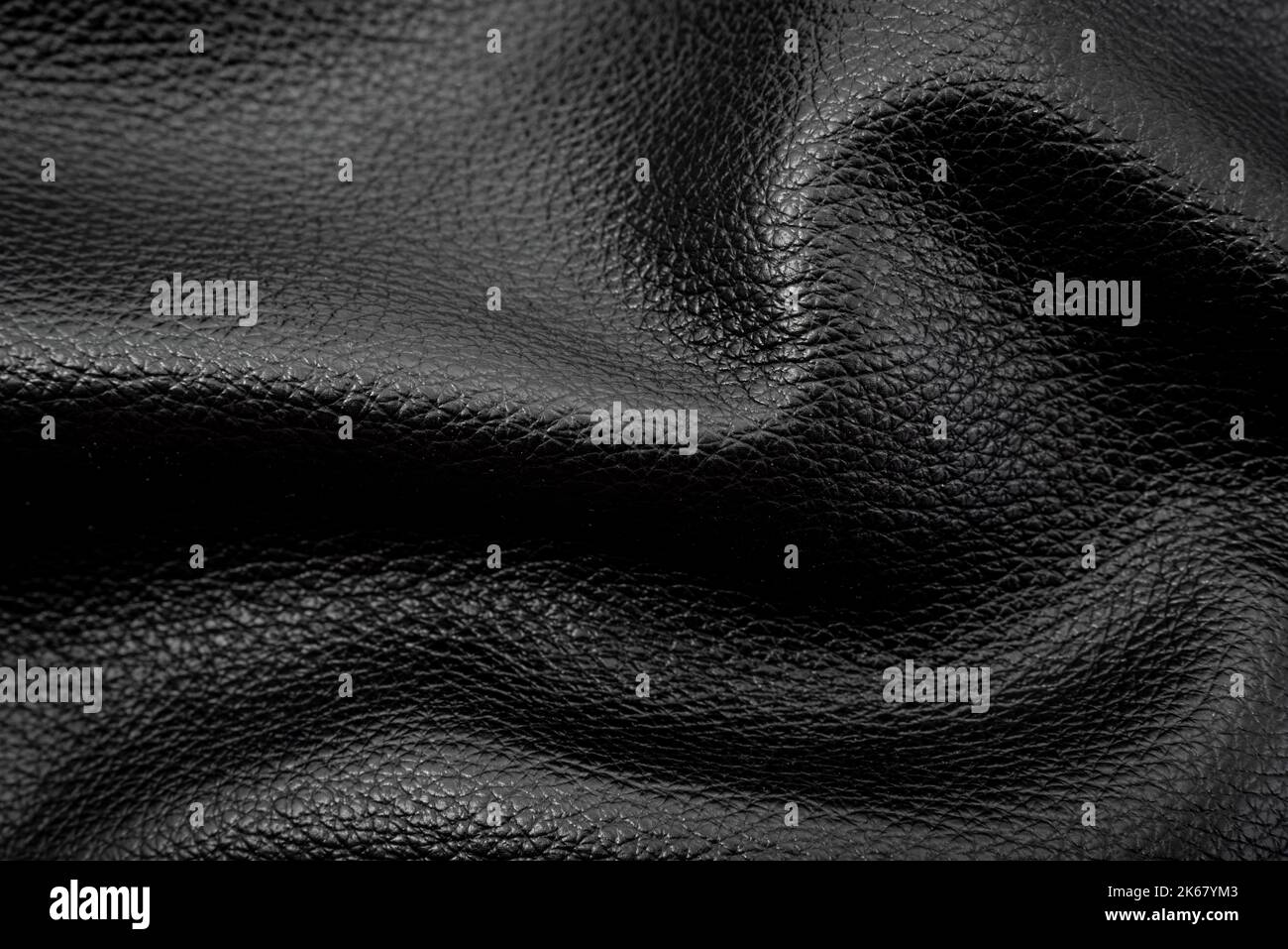 Black leather texture. Abstract background of dark leather with small ...