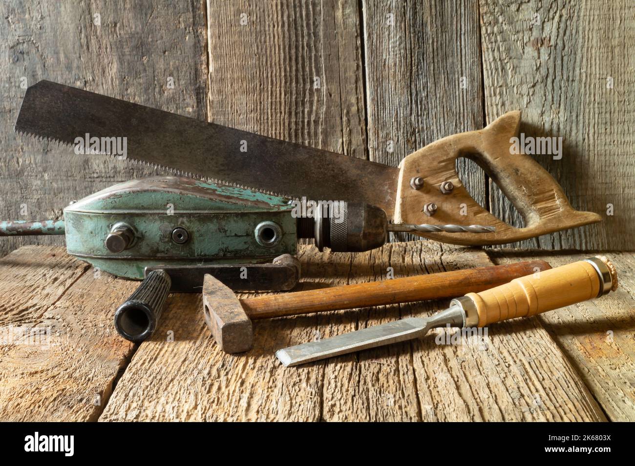 A set of tools on a wooden board. Industrial objects on a gray ...