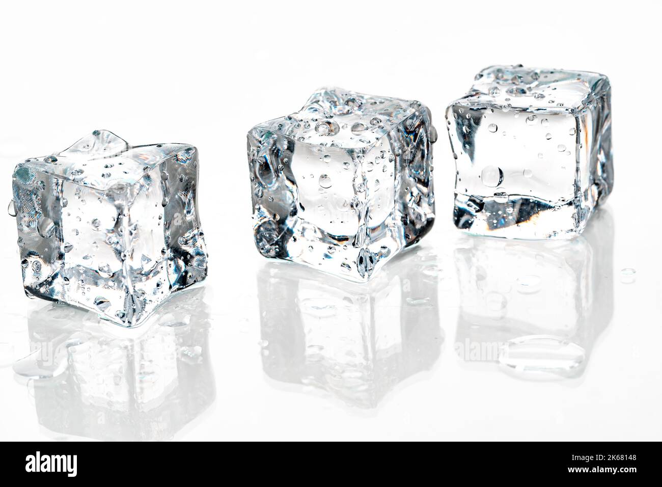 ice cubes on white background Stock Photo - Alamy