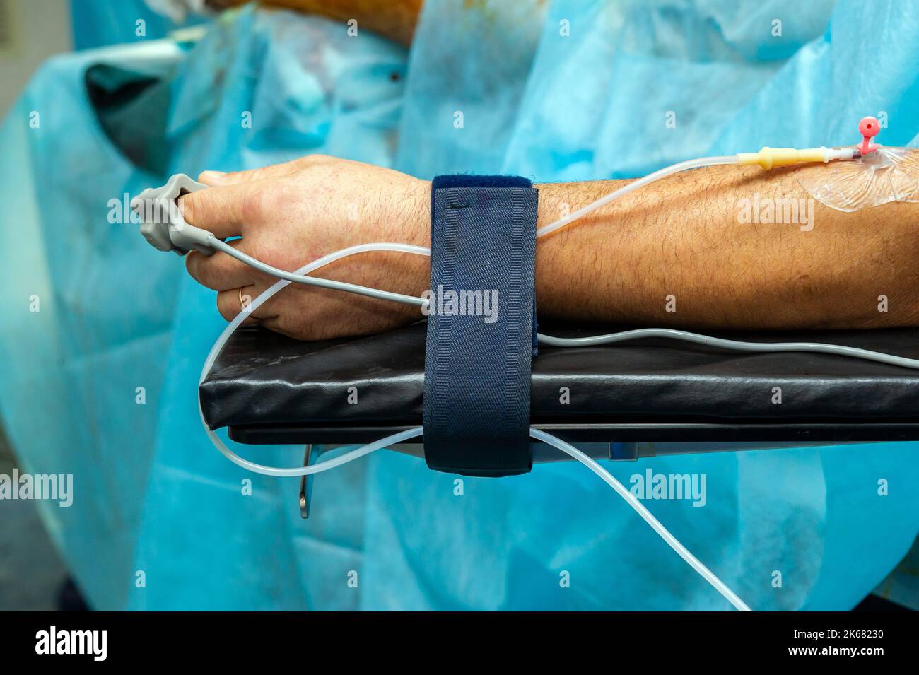 Arm of patient with drip under anesthesia during operation Stock Photo ...