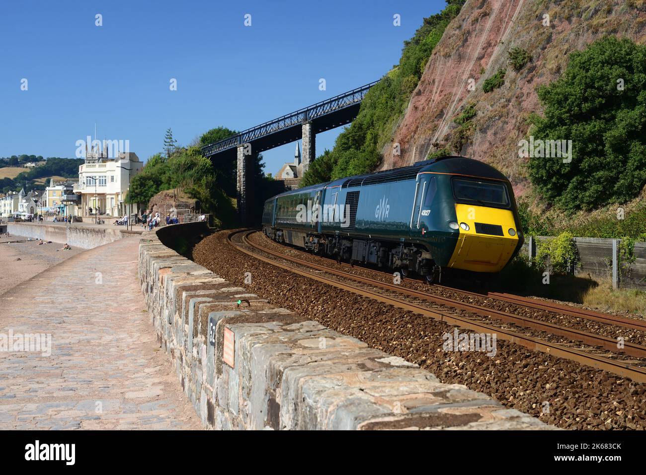 A GWR Intercity125 high speed train rounds the curve at Teignmouth with ...