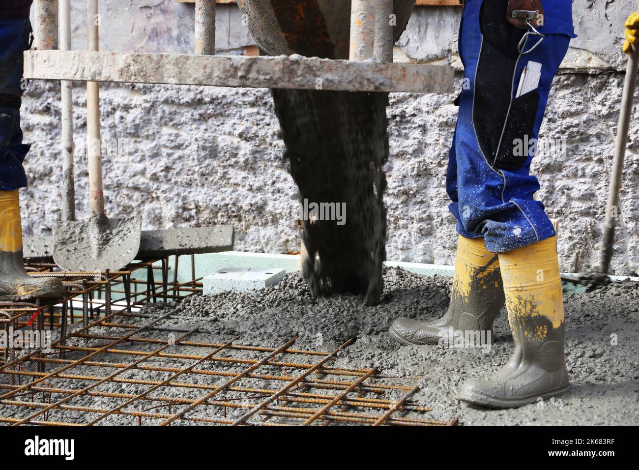 Concreting a base plate with ready-mixed concrete on the construction ...