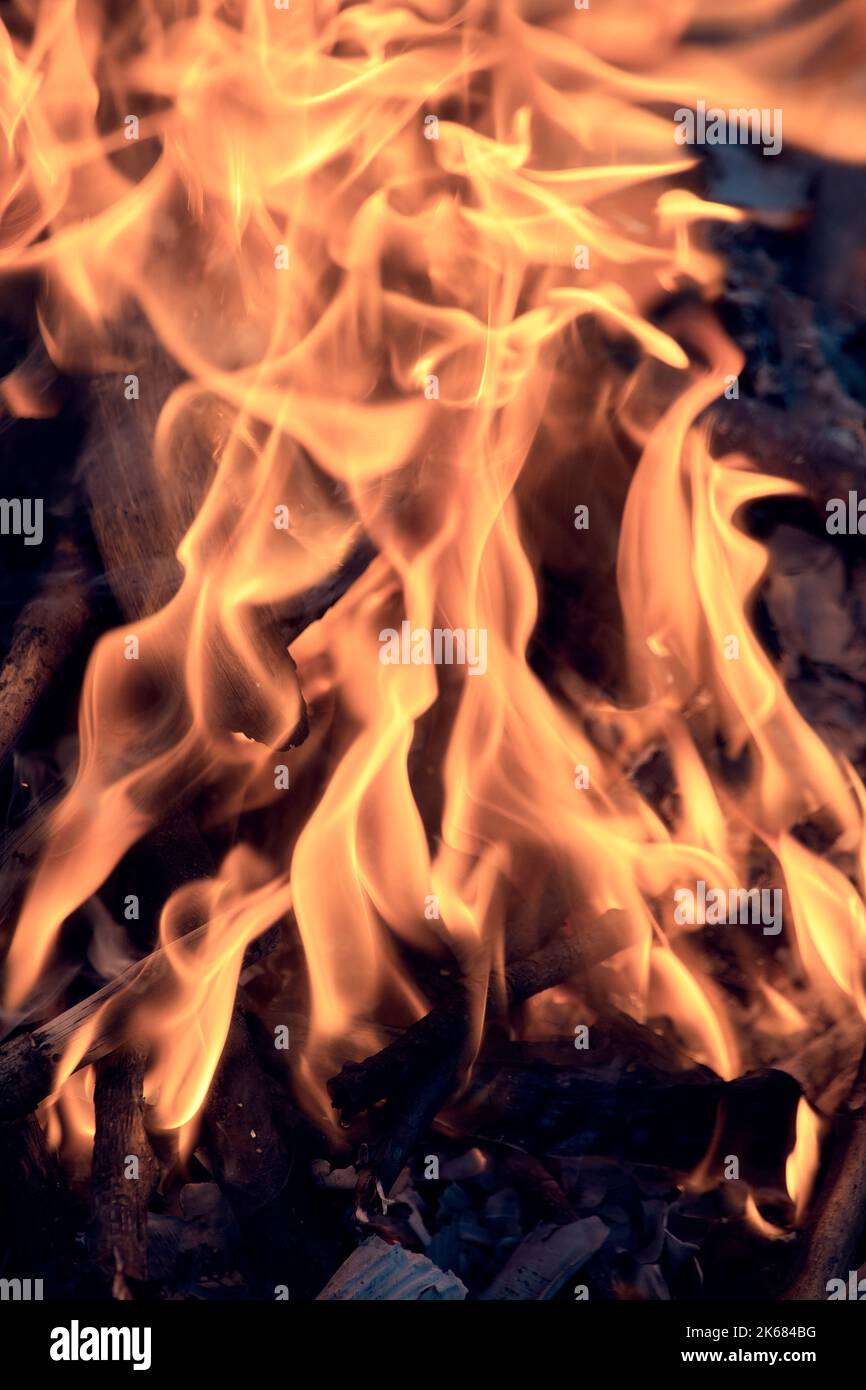 A vertical closeup of fiercely burning orange fire Stock Photo - Alamy