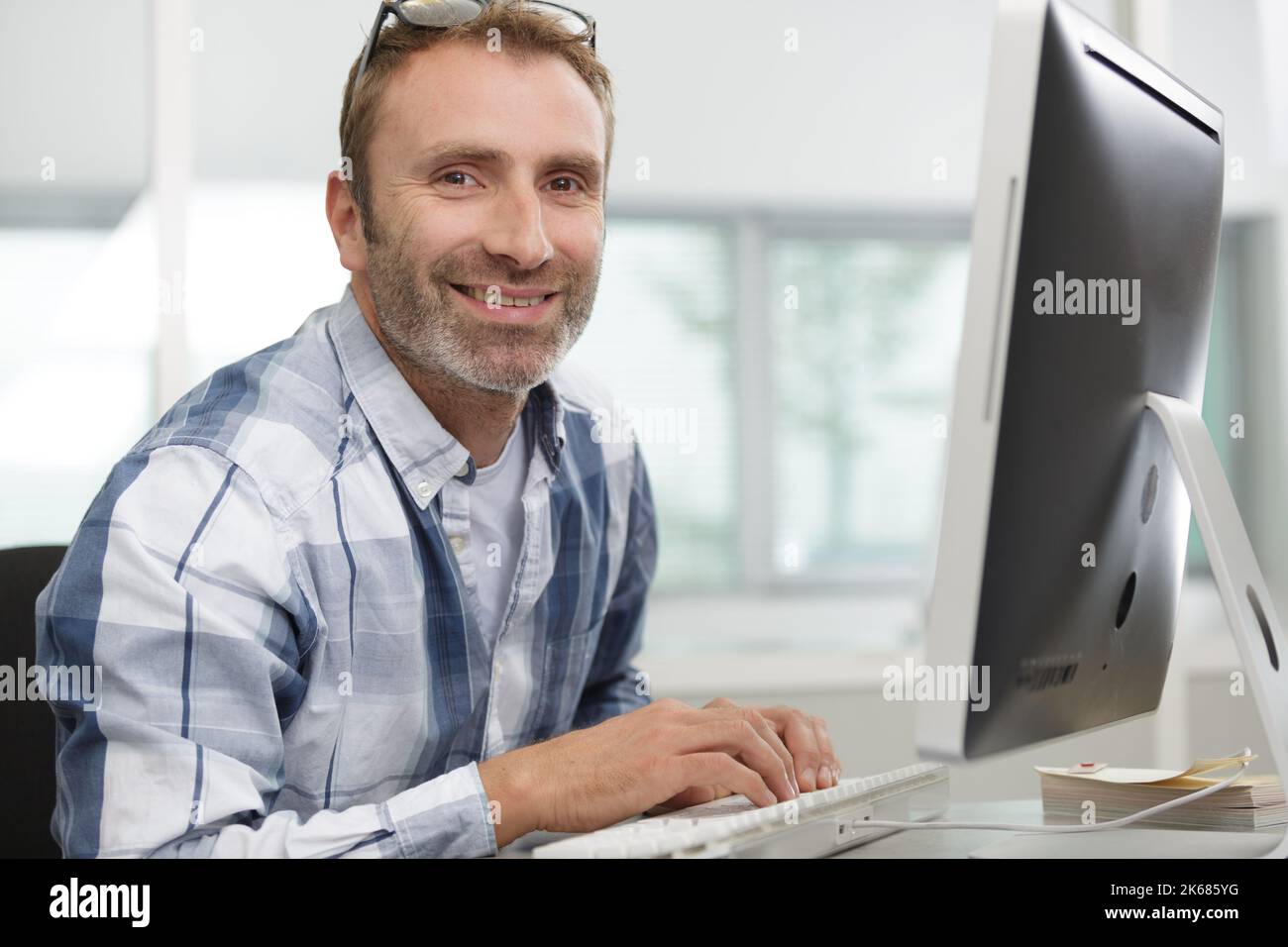 happy man working with laptop from home Stock Photo - Alamy