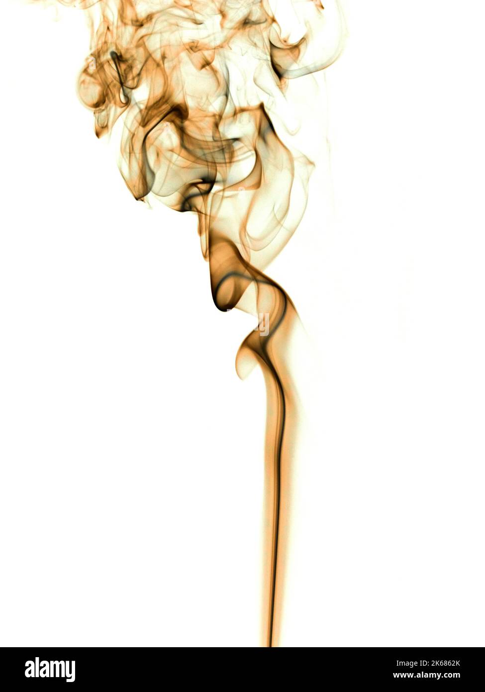 A thin stream of orange smoke curls and rises spectacularly over a ...