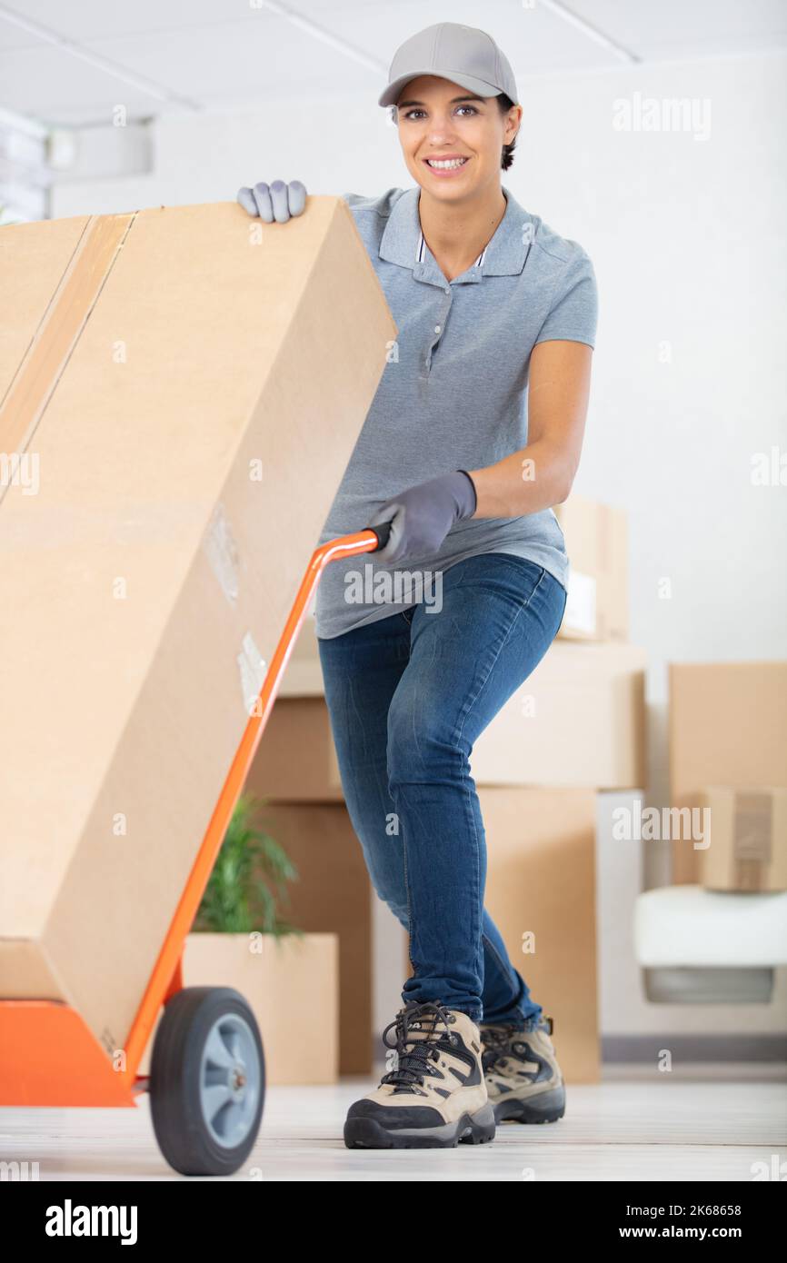 professional female mover doing home relocation Stock Photo - Alamy