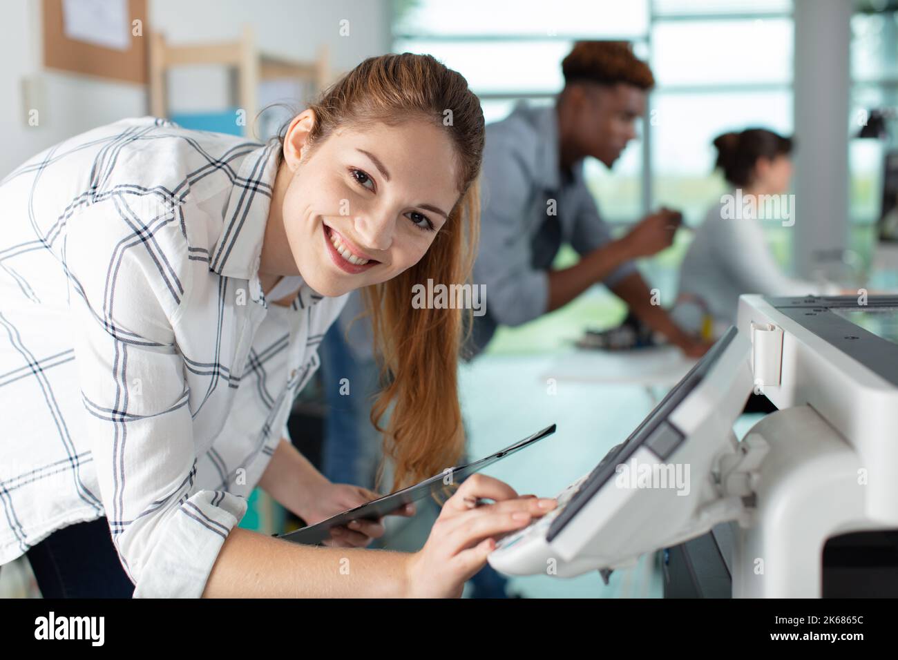 happy young woman on printer maintenance Stock Photo - Alamy