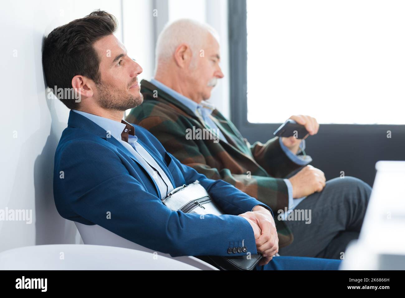 businessmen in the waiting room Stock Photo - Alamy