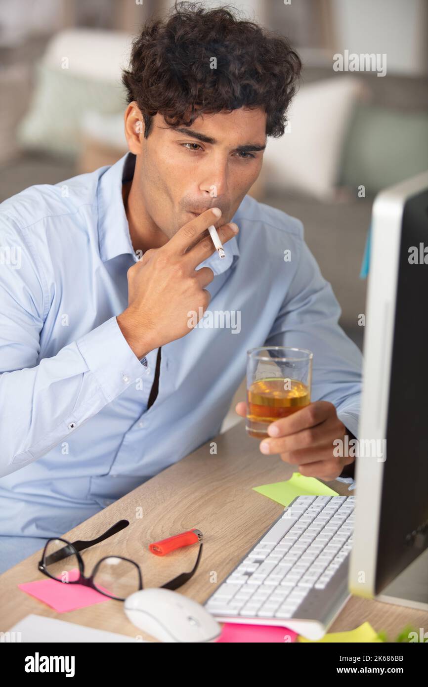 young sad and wasted messy business man Stock Photo - Alamy