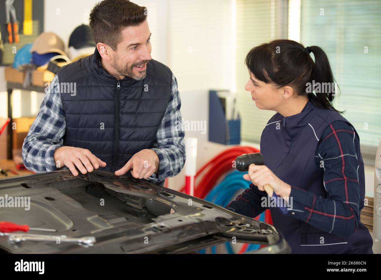car repairers at work in the garage Stock Photo - Alamy