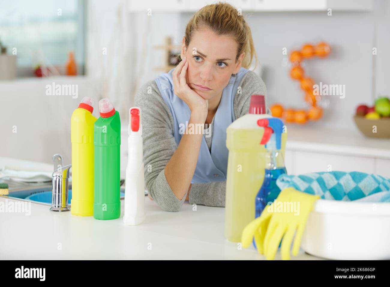 a bored woman has to wash the dishes Stock Photo - Alamy