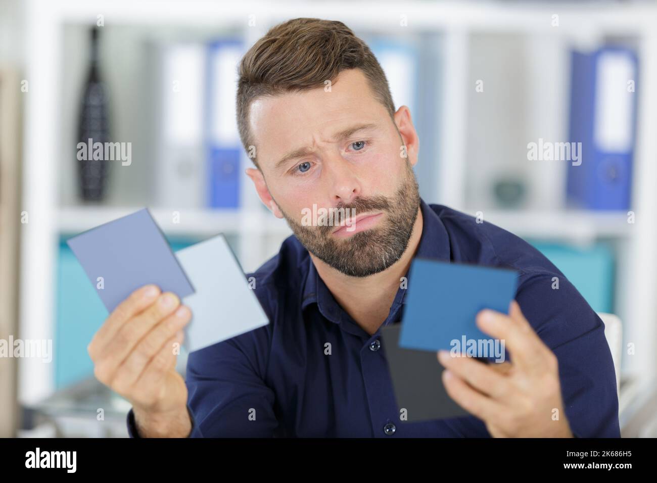 male interior designer at his desk Stock Photo - Alamy