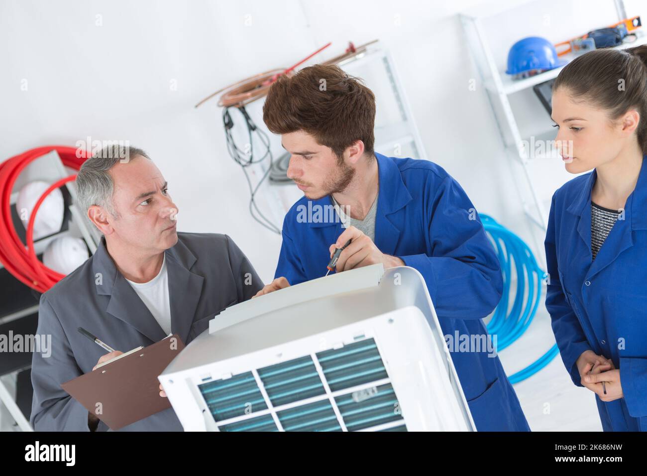 fixing and maintaining air conditioning system Stock Photo - Alamy