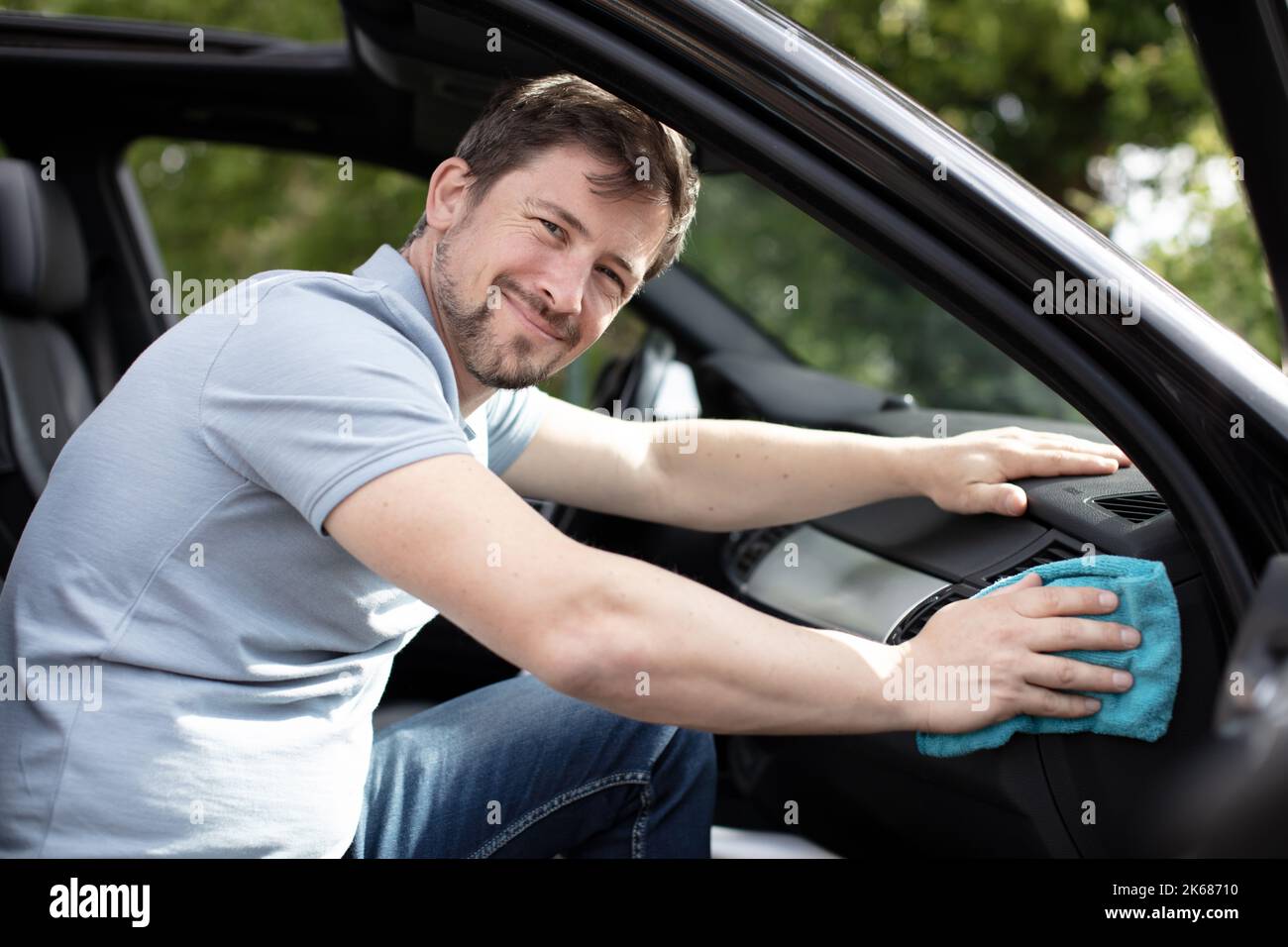 happy man is cleaning inside of the car Stock Photo - Alamy