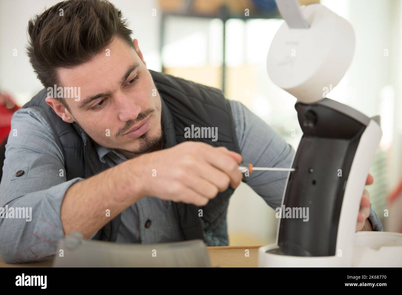 Male repairman coffee machine hi-res stock photography and images - Alamy