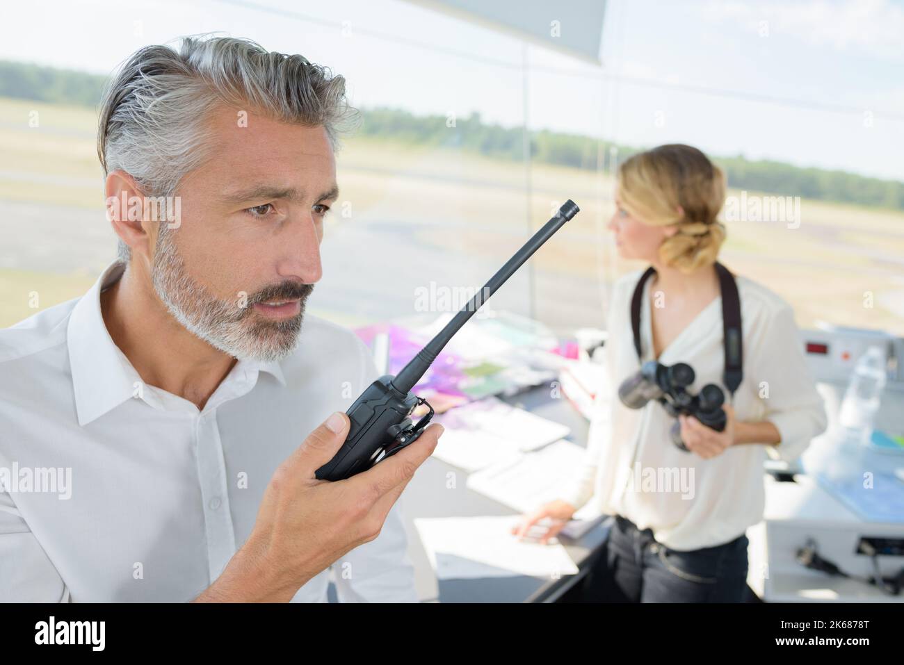 the airport team activity with walkie Stock Photo - Alamy