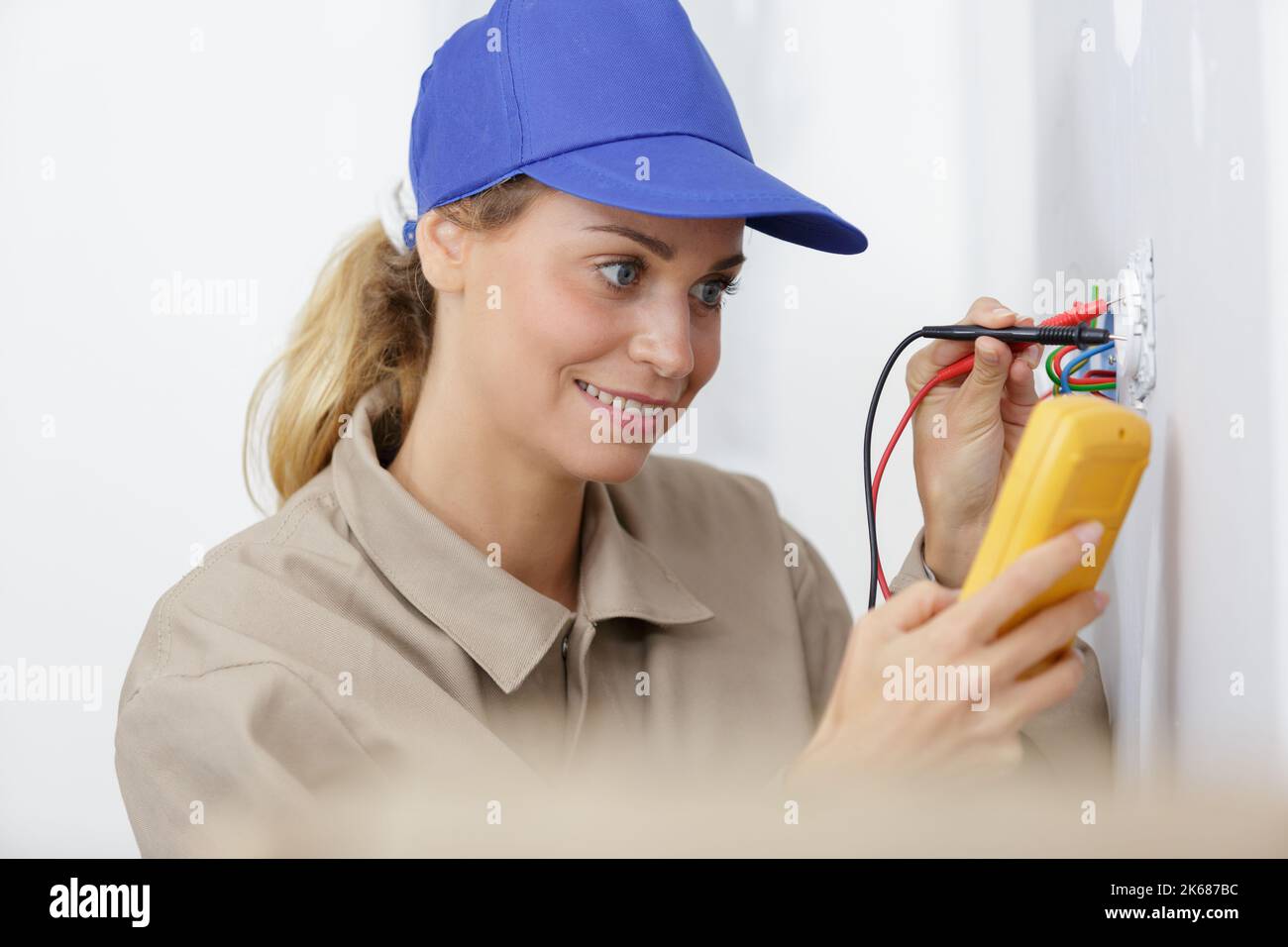 portrait of a female worker with cables Stock Photo - Alamy