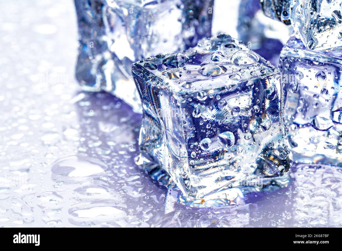 ice cubes on blue background Stock Photo - Alamy