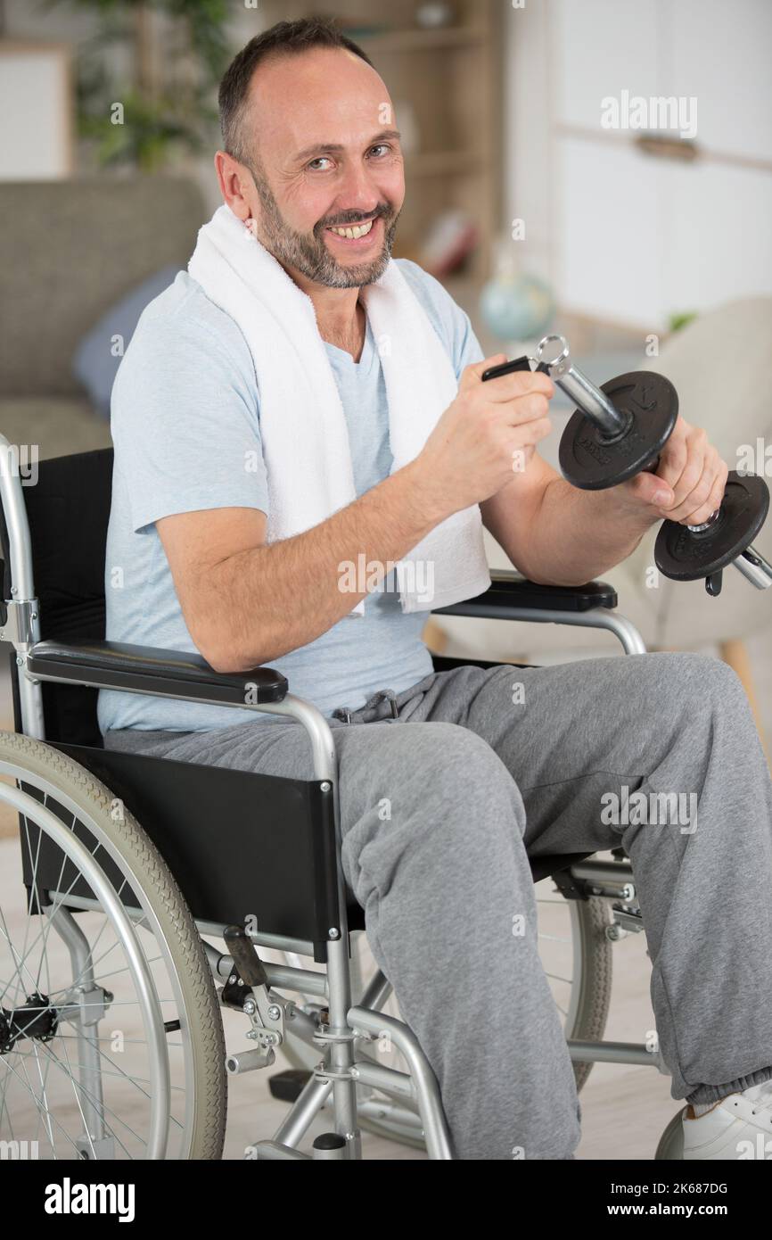 a happy disable man doing exercises Stock Photo - Alamy