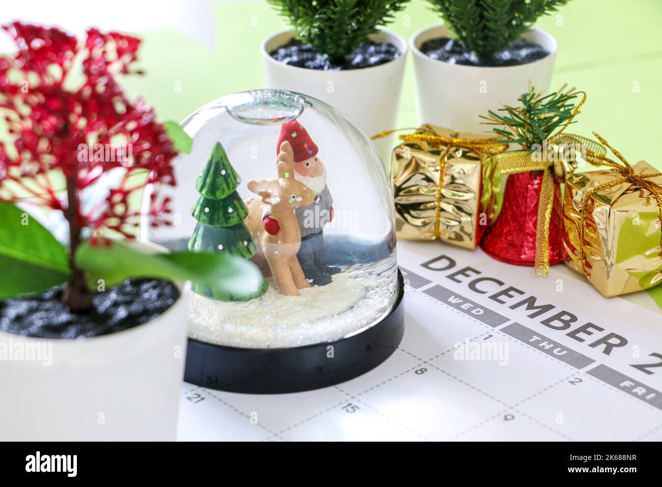 Countdown to Christmas, festive snow globe and other decorations on ...