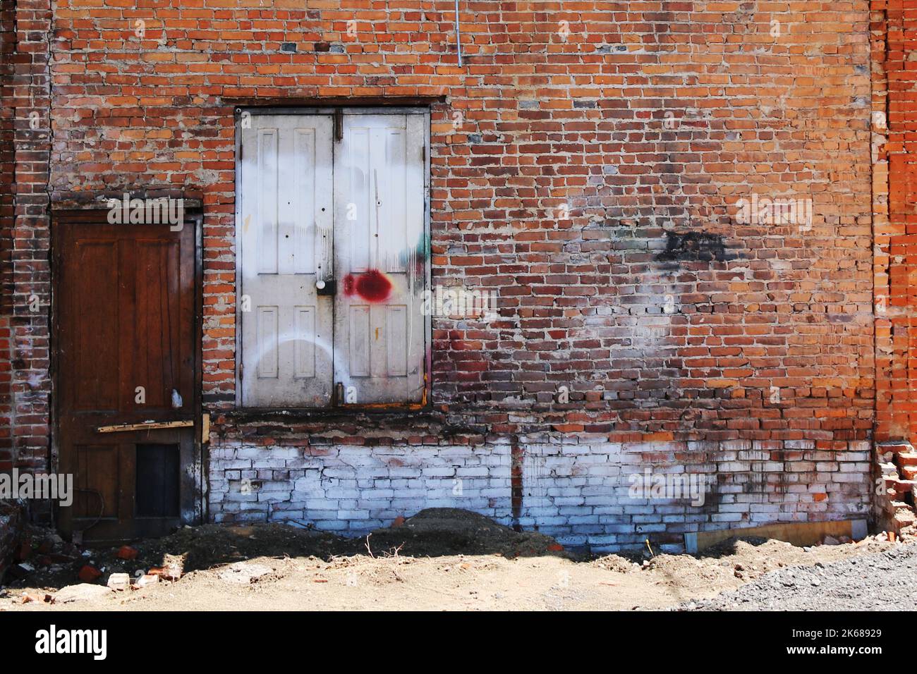 a distressed abandoned war empty brick wall warehouse desperate factory ...