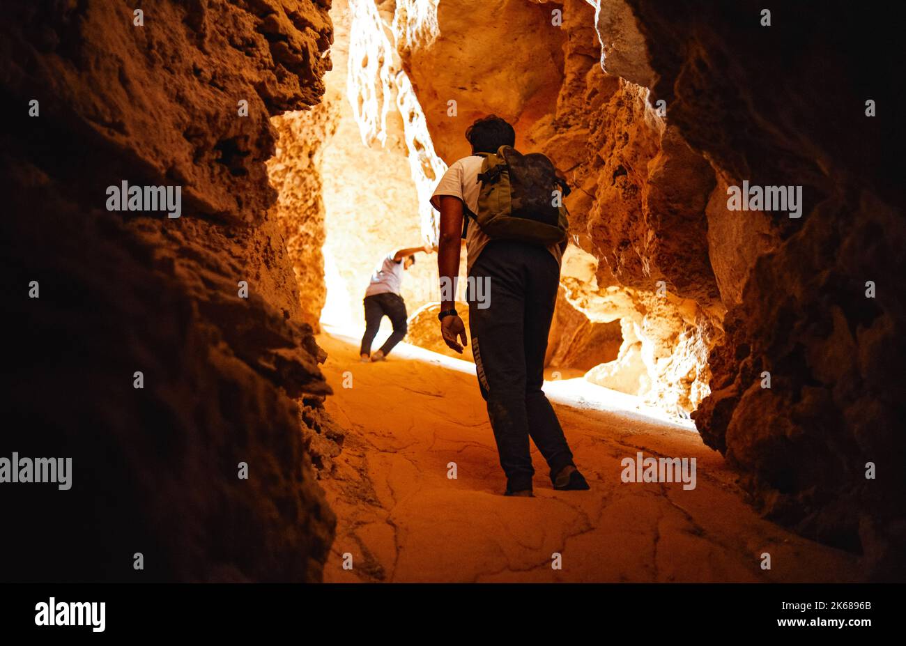 People inside a cave Stock Photo - Alamy