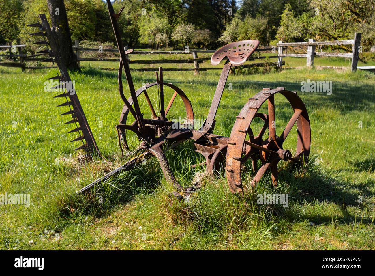 WA22214-03...WASHINGTON - Old plow on display near the old house at the ...