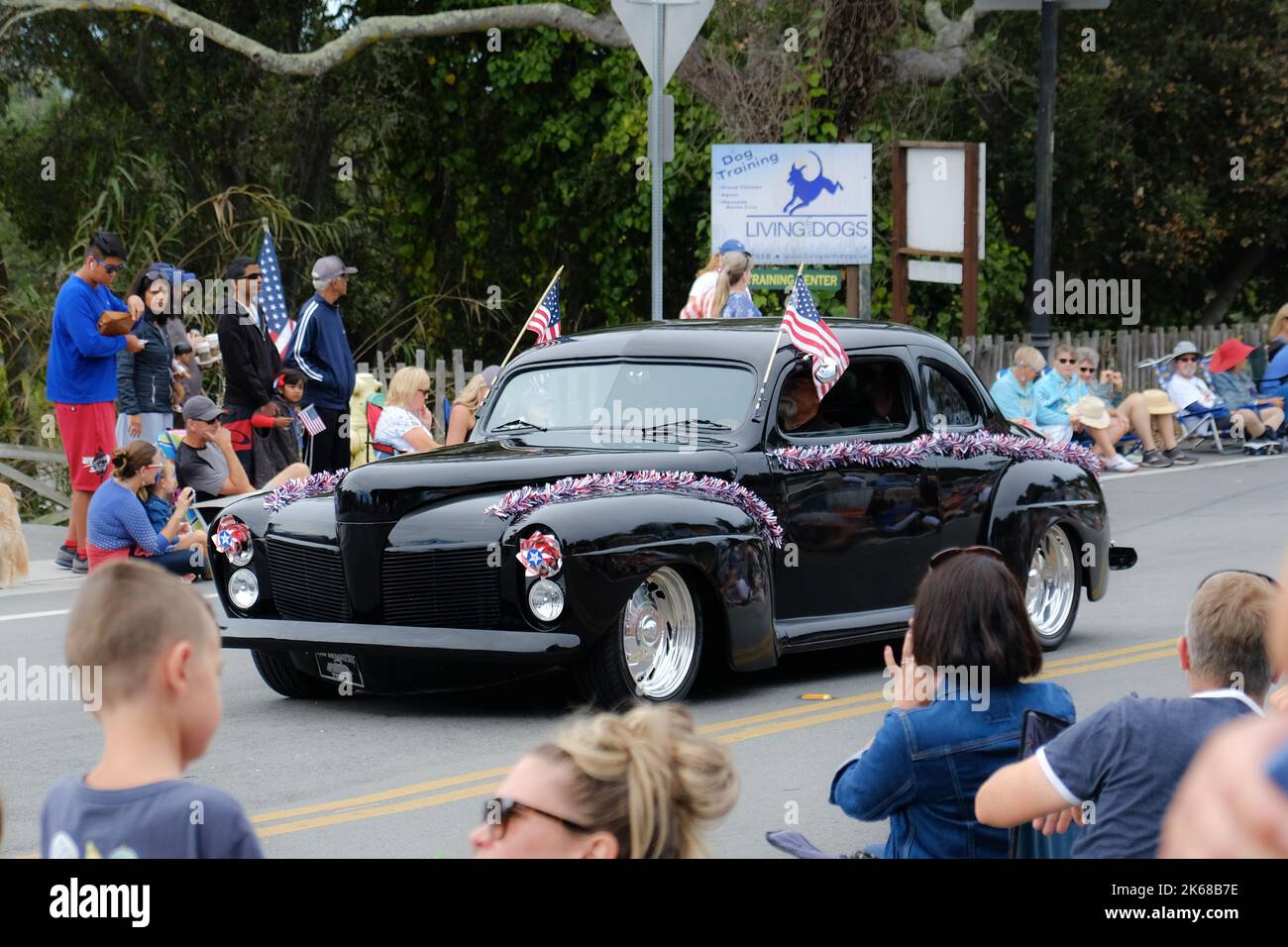 A classic car decorated with the American flags for the independence ...