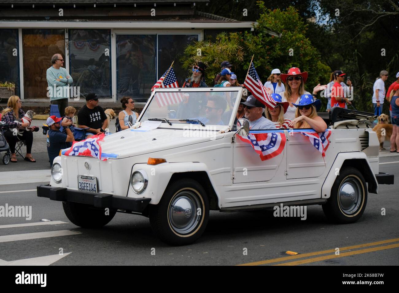 A classic car decorated with the American flags in an independence day ...