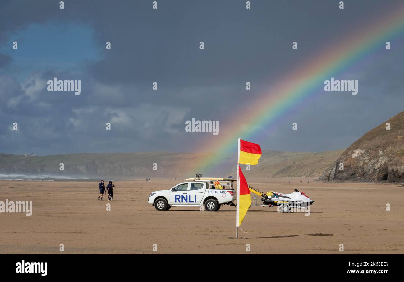 A rainbow shining on a RNLI vehicle at Perranporth, Cornwall. Jet ski ...