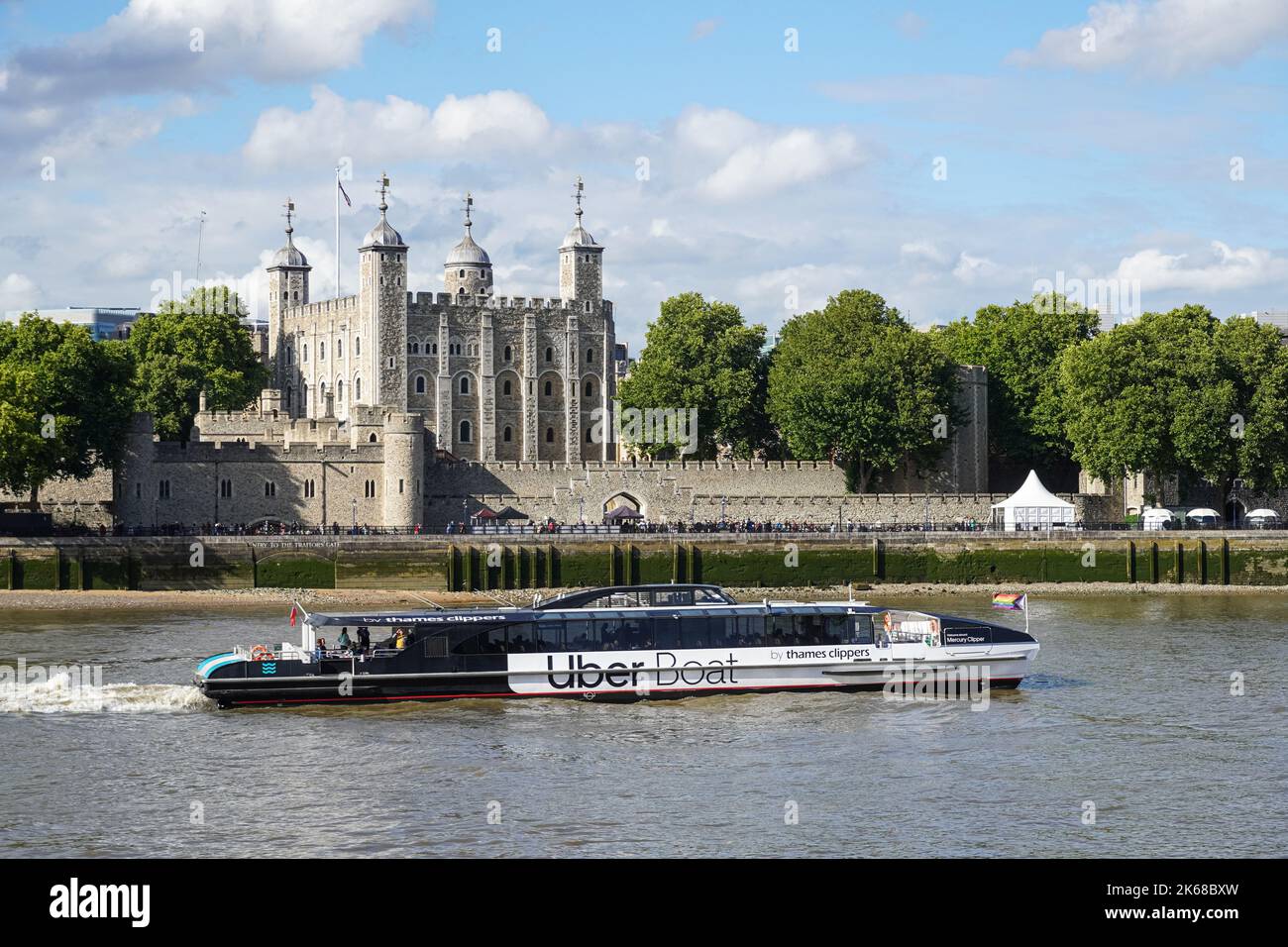 Thames clipper, Uber Boat passing the Tower of London on the River ...