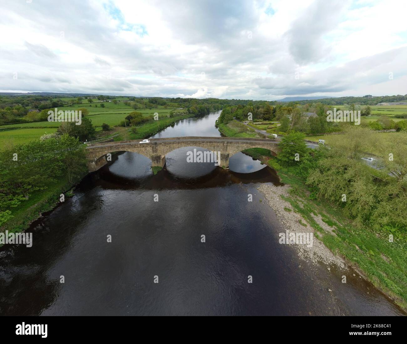 An aerial view of Ribchester bridge in daylight in Ribchester, England ...