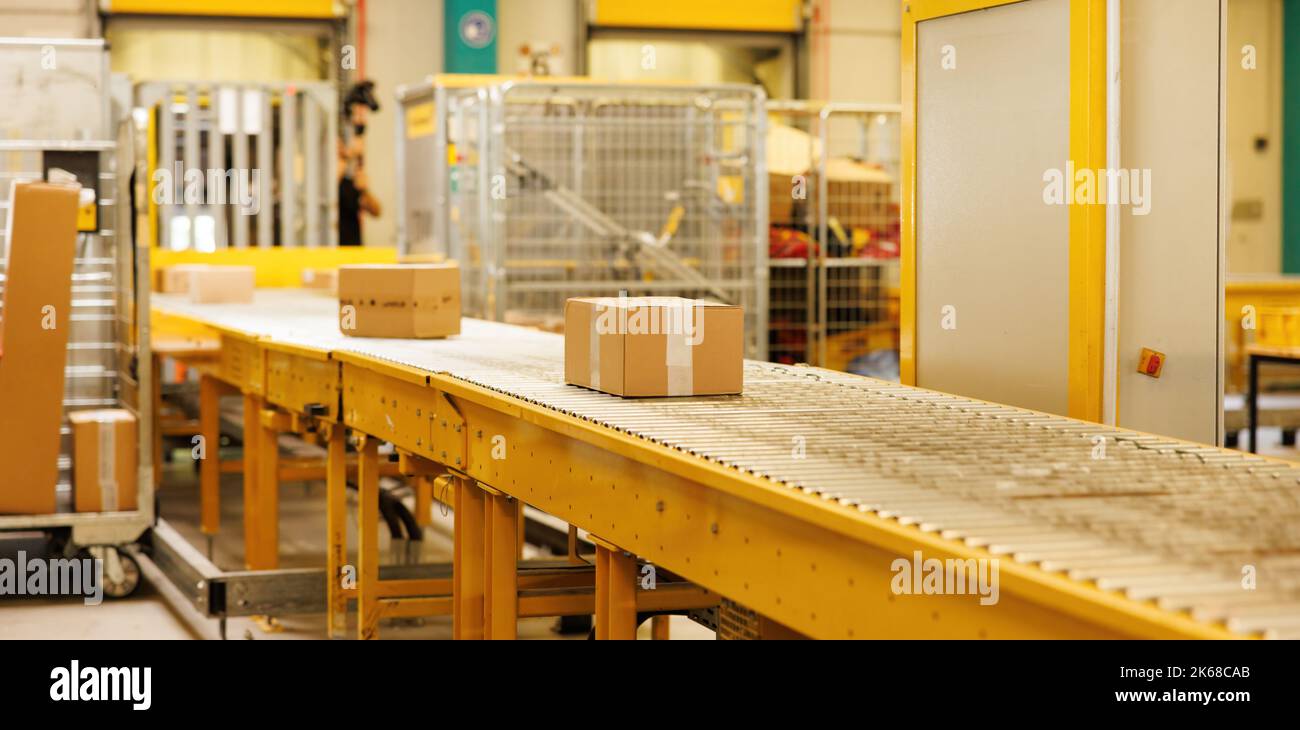The parcel is on the conveyor belt. Concept of automatic logistics ...