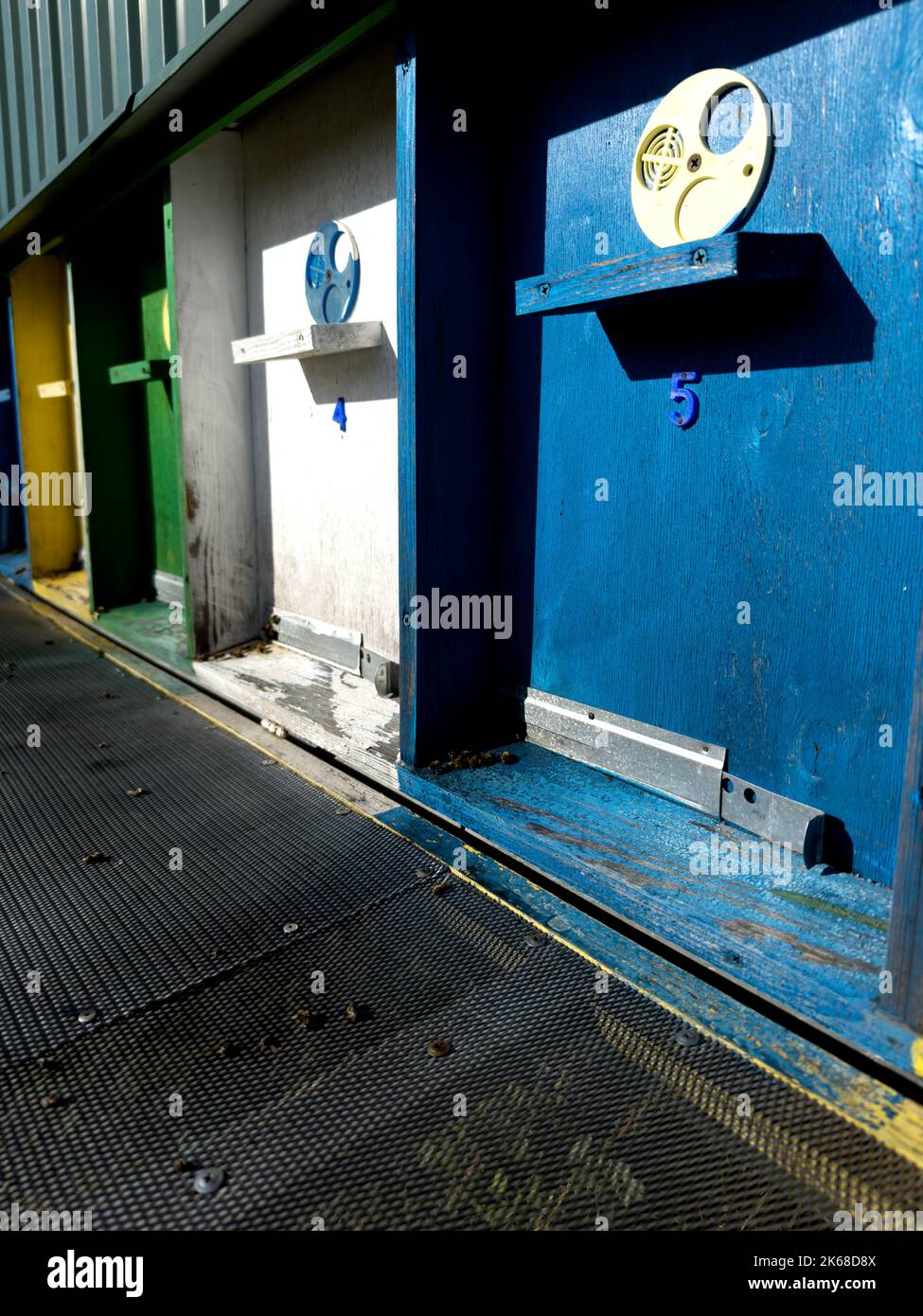 Multi-colored bee hives on a trailer. Mobile apiary Stock Photo - Alamy
