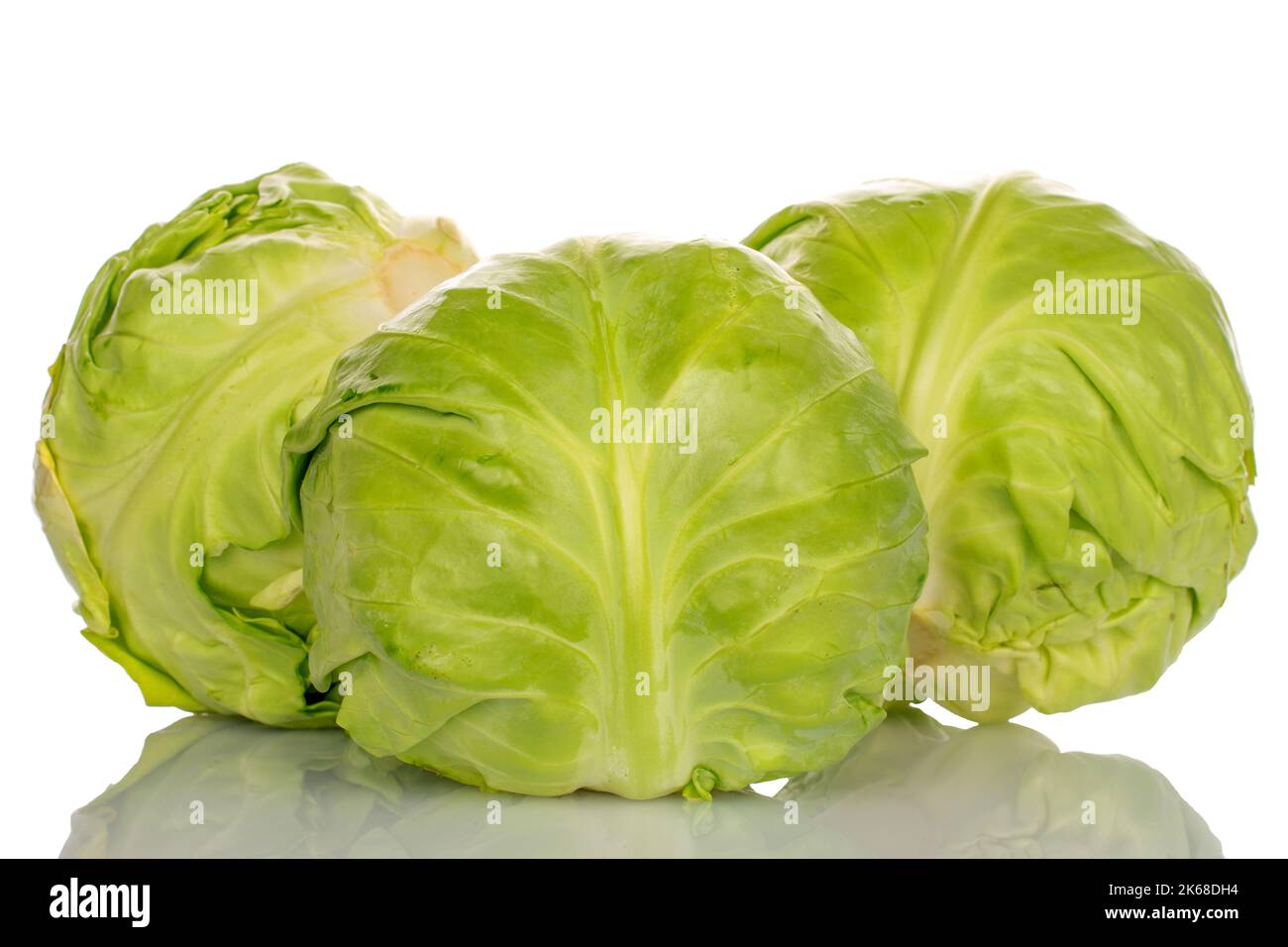 Three fresh white cabbage, macro, isolated on white background Stock ...