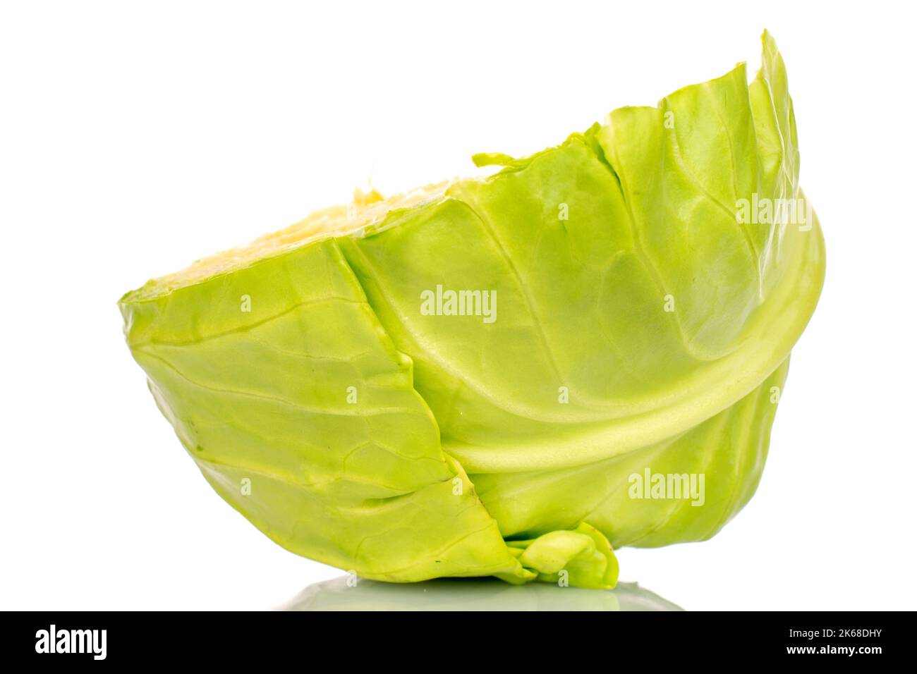 One half of fresh white cabbage, macro, isolated on white background ...