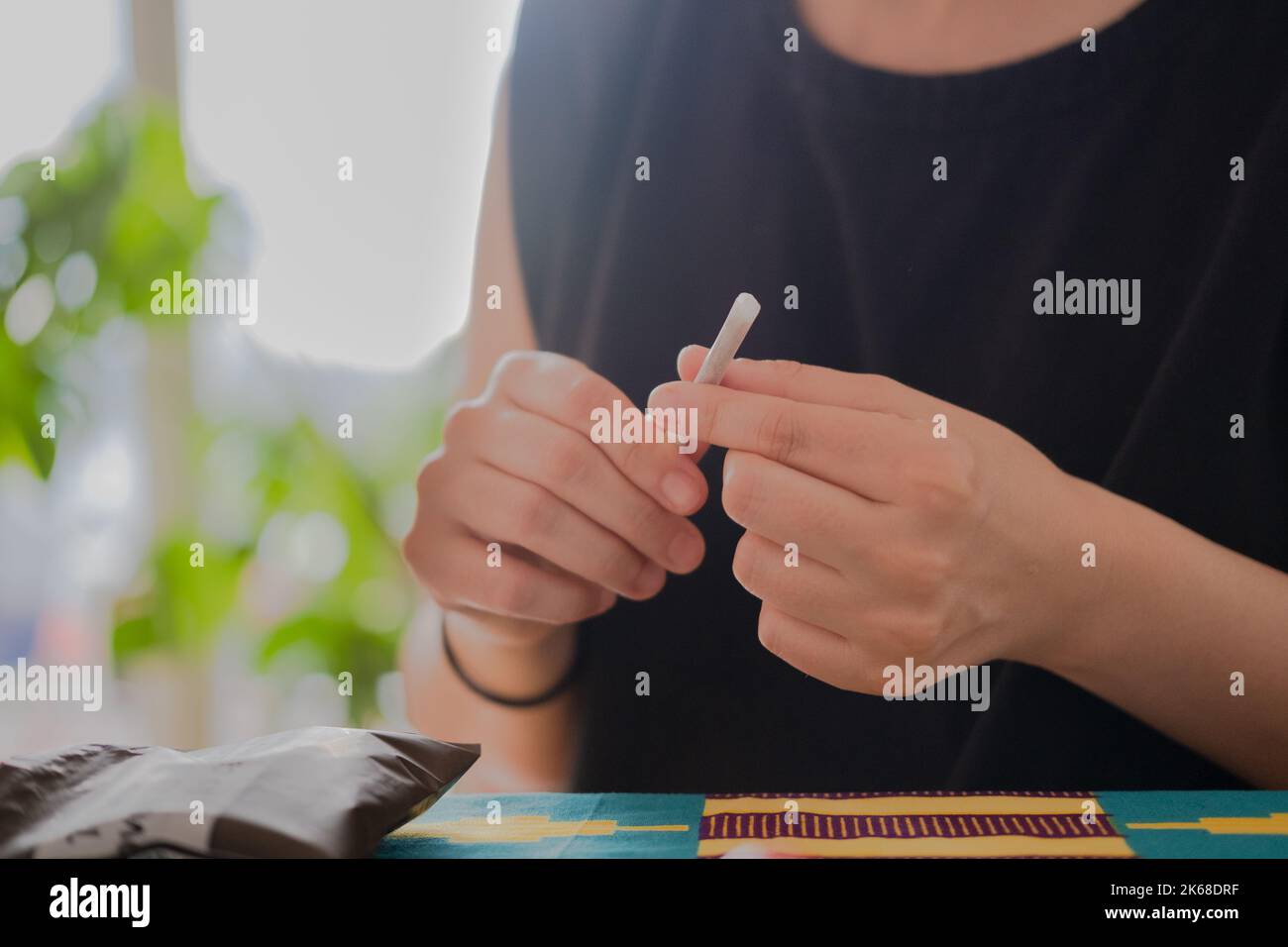 Woman smoking roll up cigarette hi-res stock photography and images - Alamy