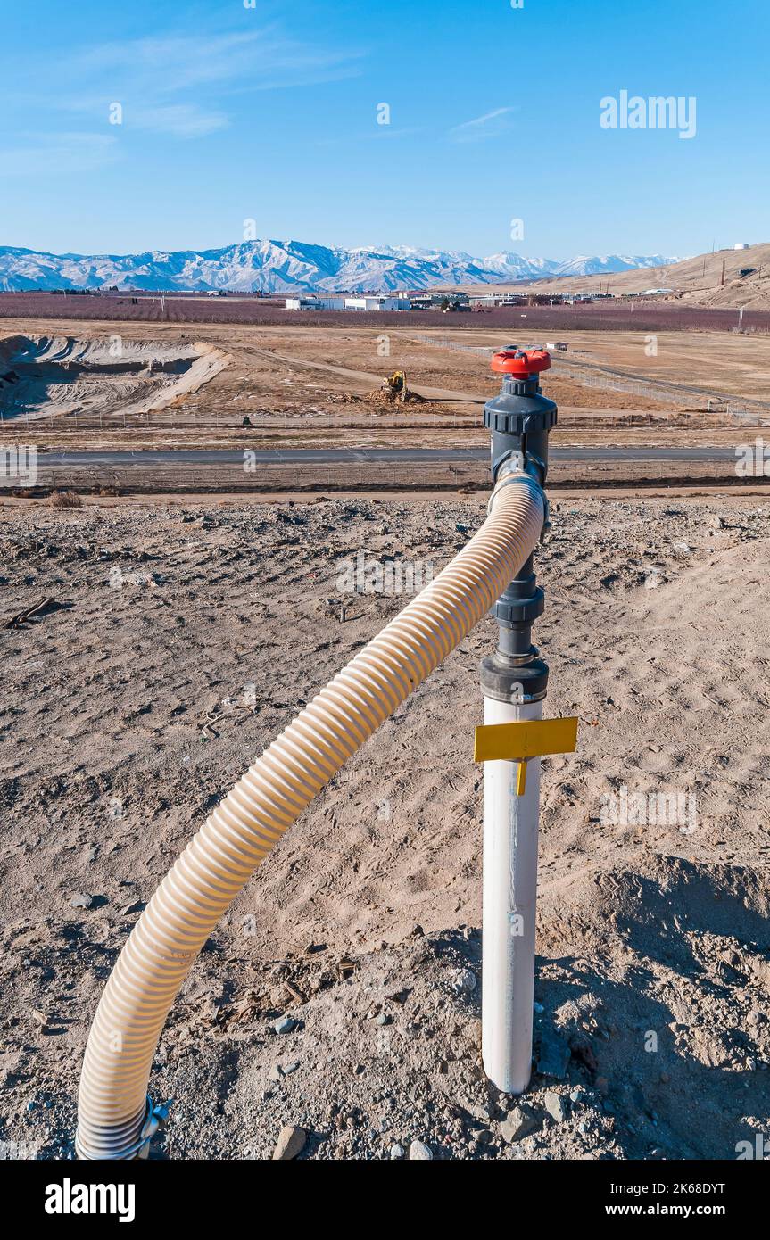 A vertical landfill methane gas well at an active landfill showing the ... A vertical landfill methane gas well at an active landfill showing the ...