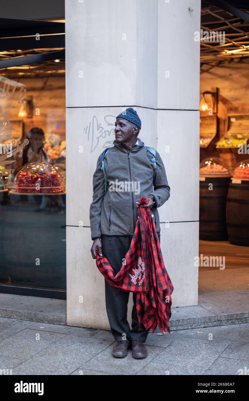 African man selling the traditional cachirulo. The Offering of Flowers ...