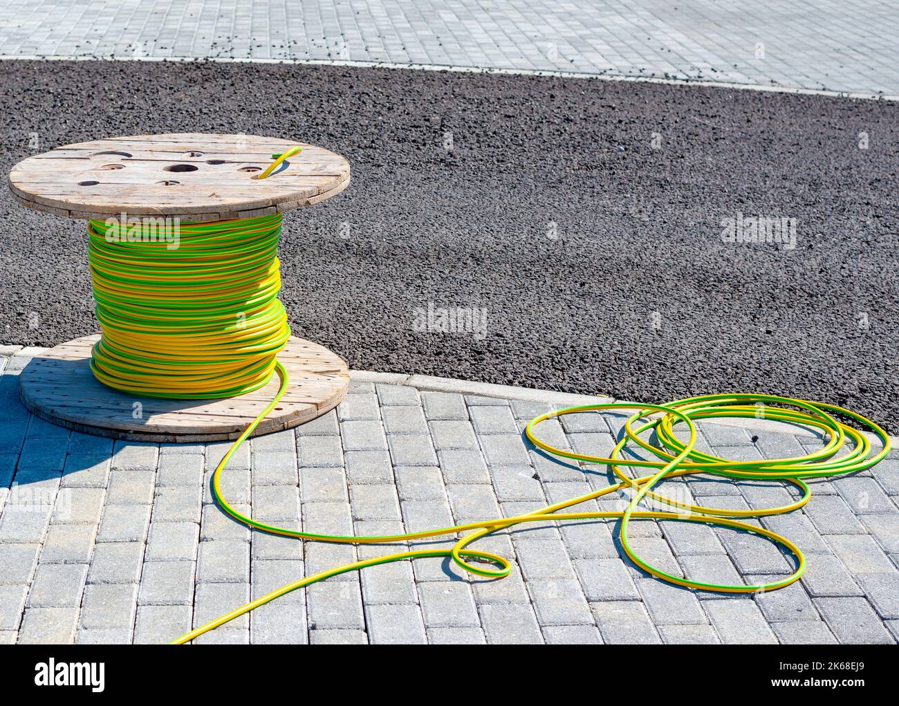 wire electric cable with wooden coil of electric cable waiting to be ...