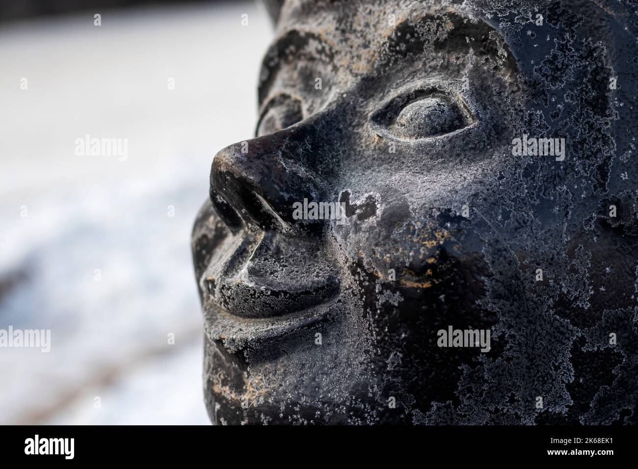 Iron statue of a male face Stock Photo - Alamy