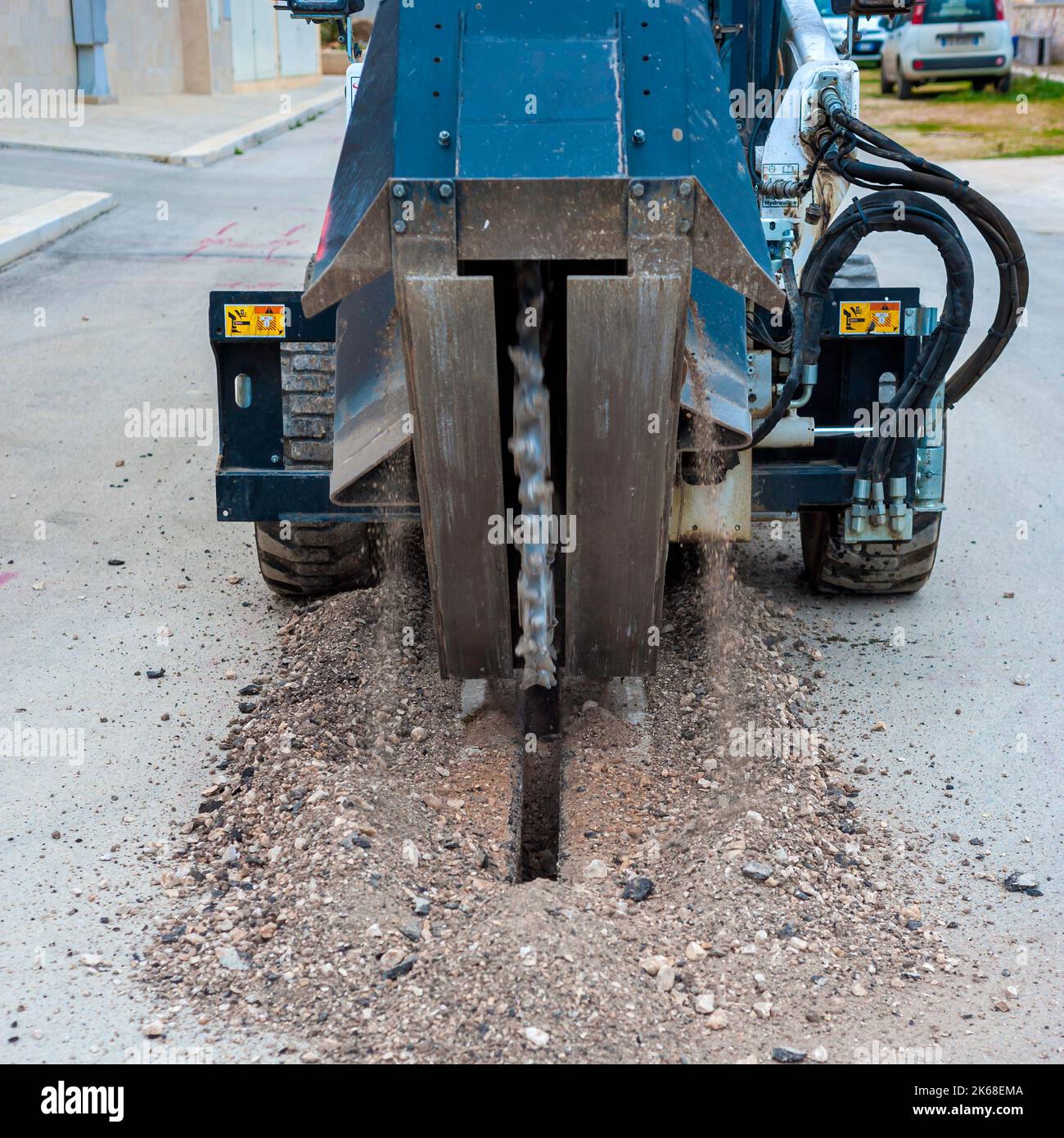 wreath with cones for drilling rock mounted on mini excavator during ...