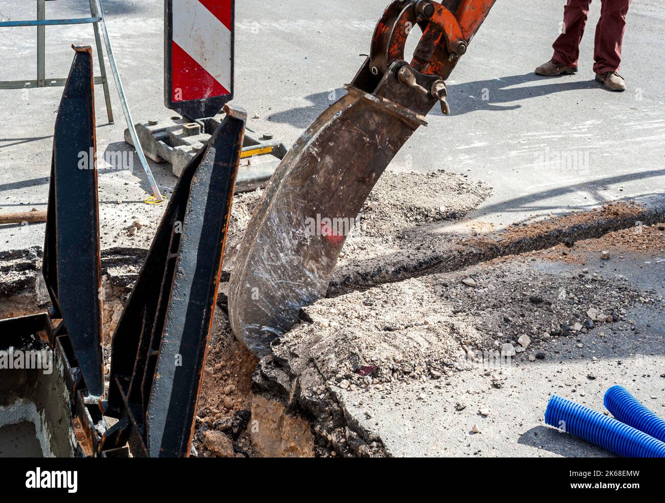 mini excavator equipped with a very narrow bucket to perform ...