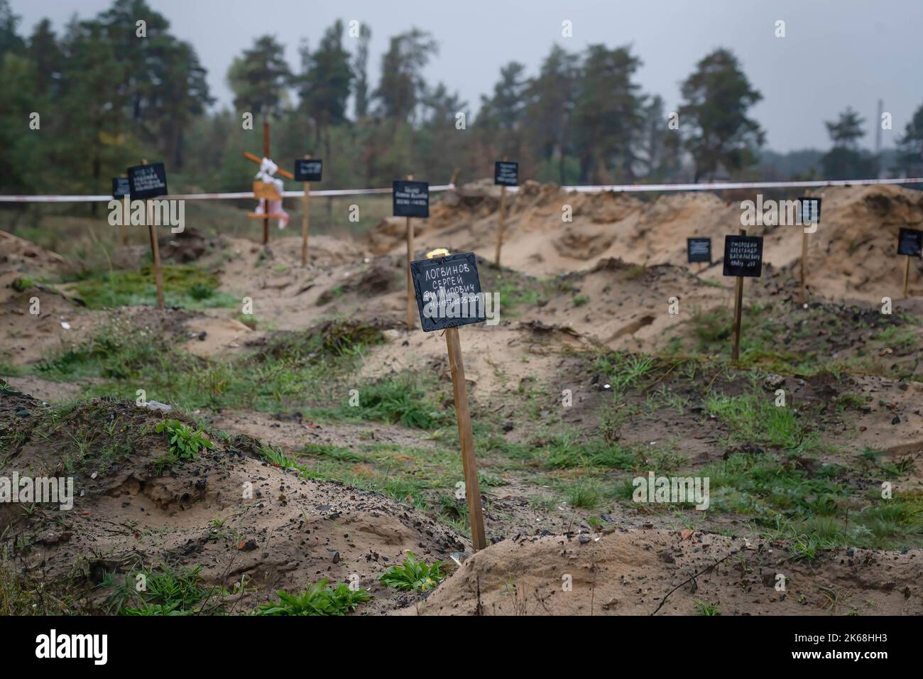 A plate written with dates and name is seen at a burial site in Lyman ...