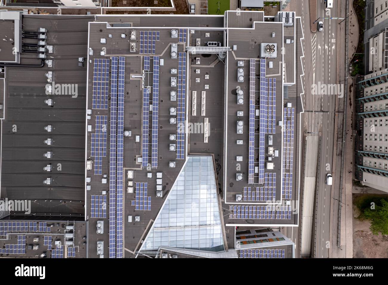 Solar panels on the roof of a shopping mall building Stock Photo - Alamy