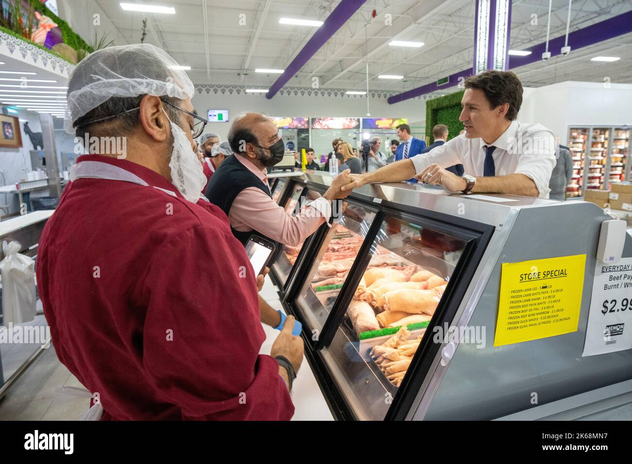 Prime Minister Justin Trudeau greets butchers at Memon Supermarket in ...