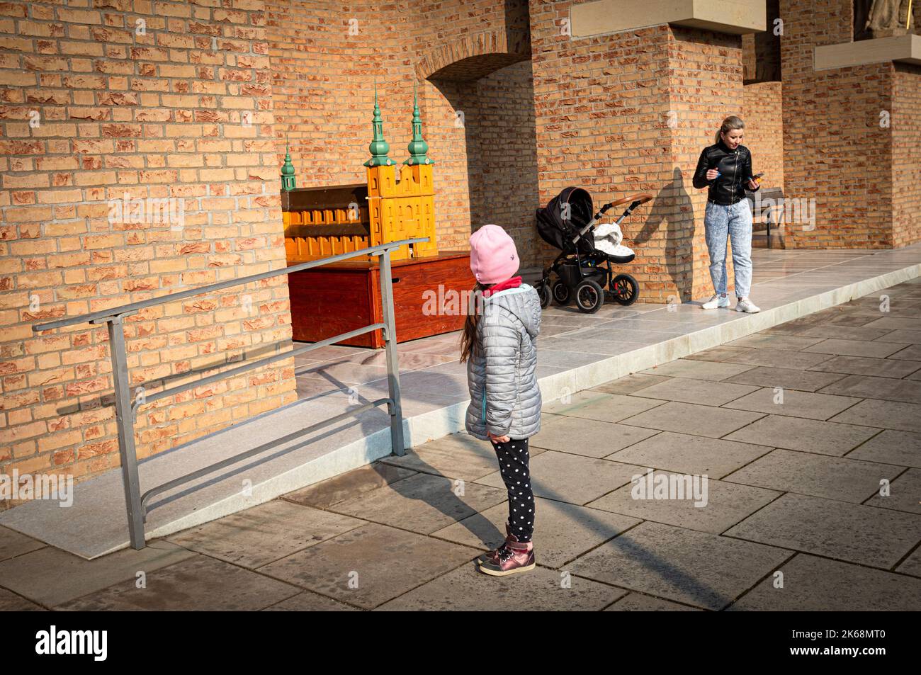 The child looks back at his mother Stock Photo - Alamy